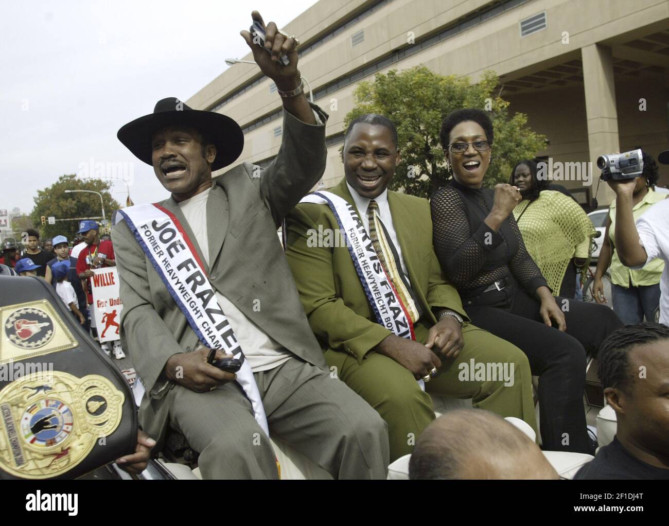 Pictured in this 2004 file photo, from left, Joe Frazier, Marvis ...