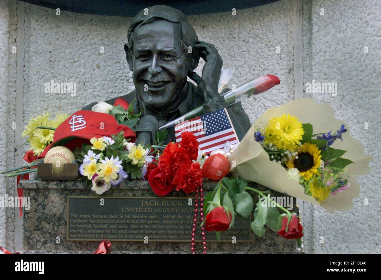In this 2002 file photo, flowers and gifts adorn a bronze bust of the ...