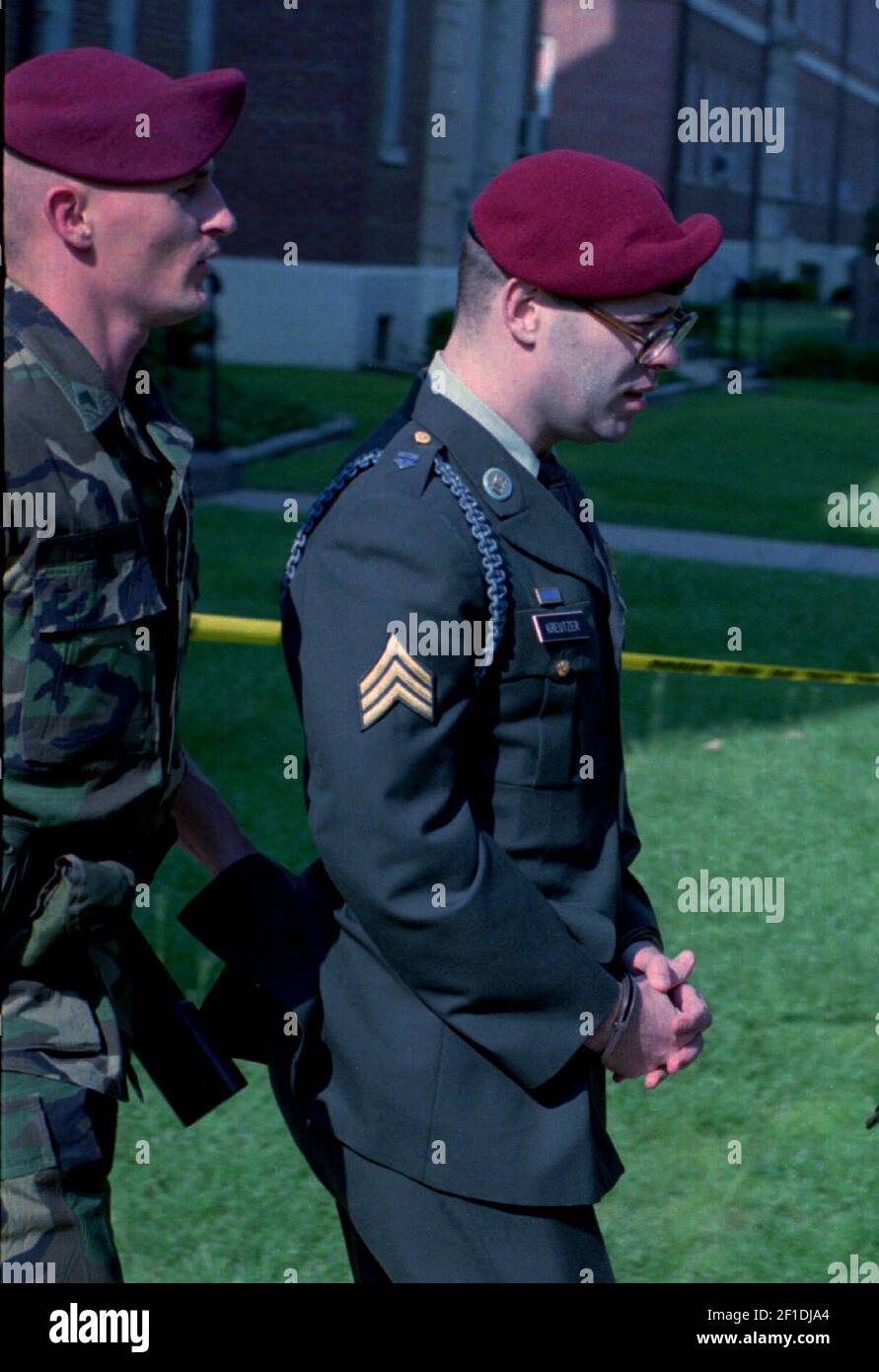 Former Army Sgt. William Kreutzer, with his hands chained to his waist ...
