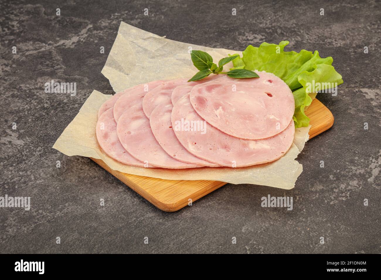 Slised ham pork snack over board Stock Photo - Alamy