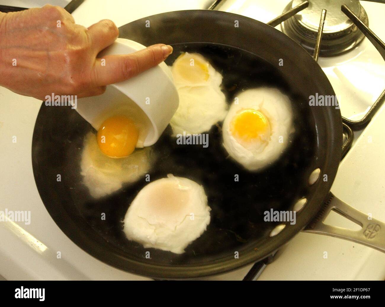Poach: To cook food gently in liquid just below the boiling point ...
