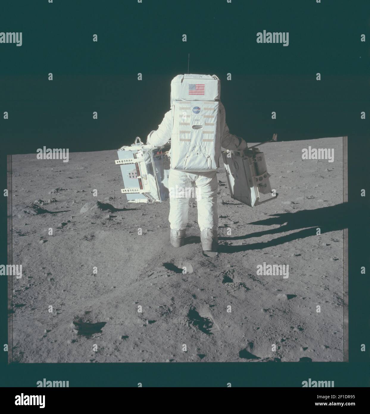 Astronaut Edwin E. Aldrin Jr., lunar module pilot, moves toward a ...