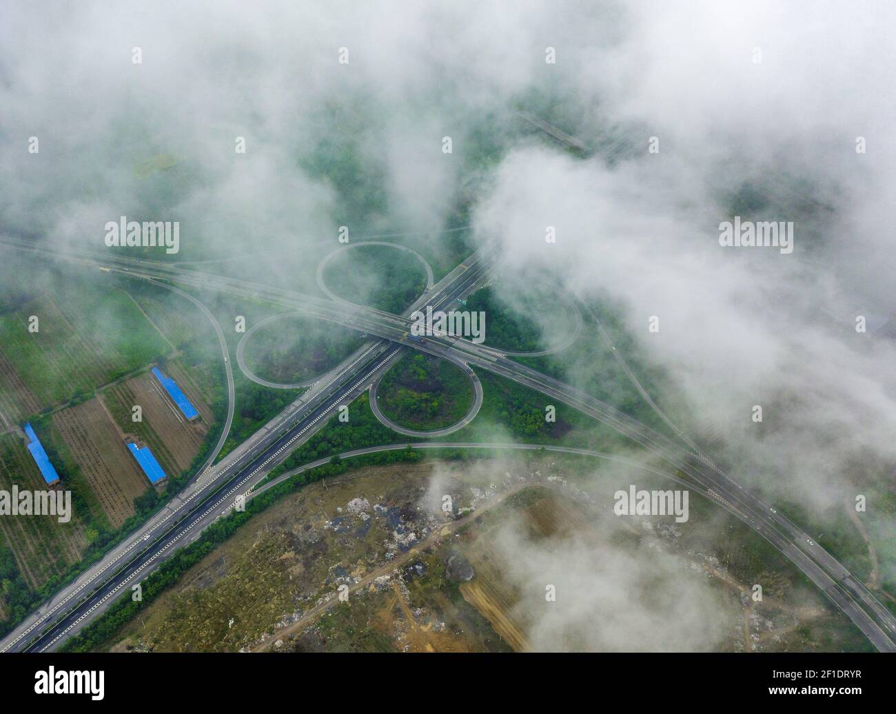 An aerial view of a complicated interchange linking different ...