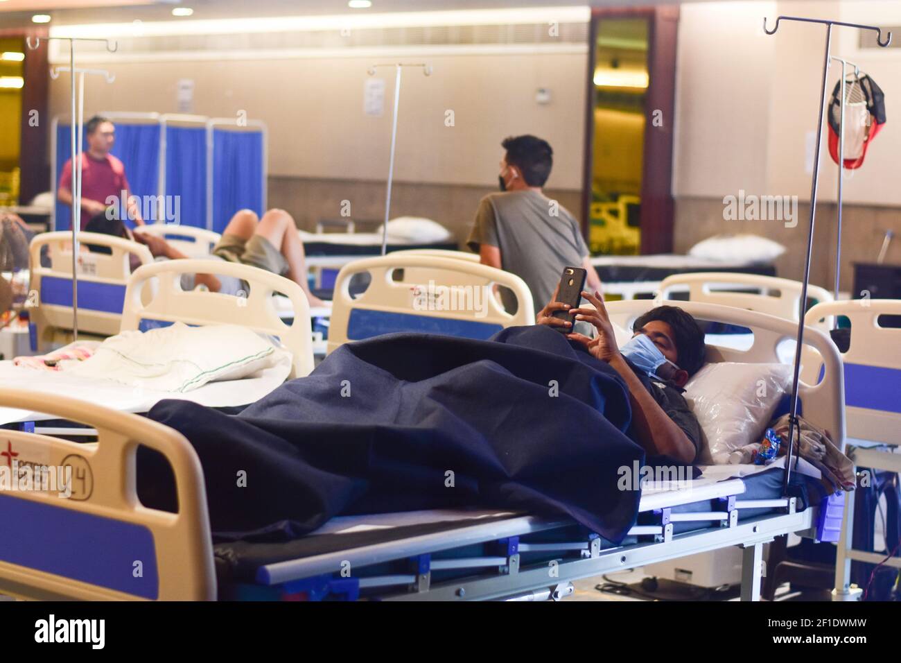 Covid-19 infected patients are seen inside the Shehnai Banquet Hall ...