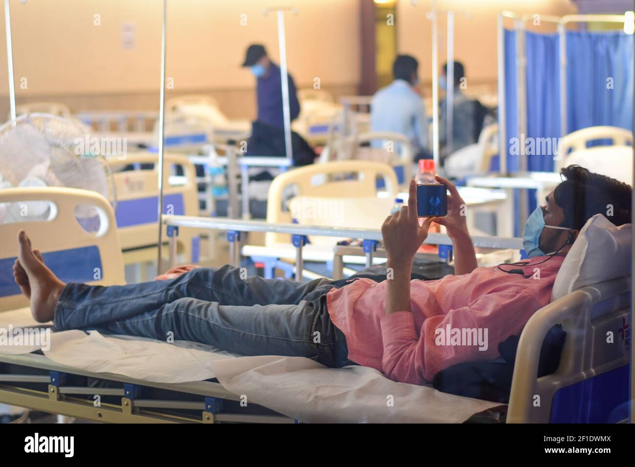 Covid-19 infected patients are seen inside the Shehnai Banquet Hall ...