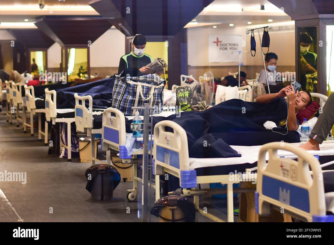 Covid-19 infected patients are seen inside the Shehnai Banquet Hall ...