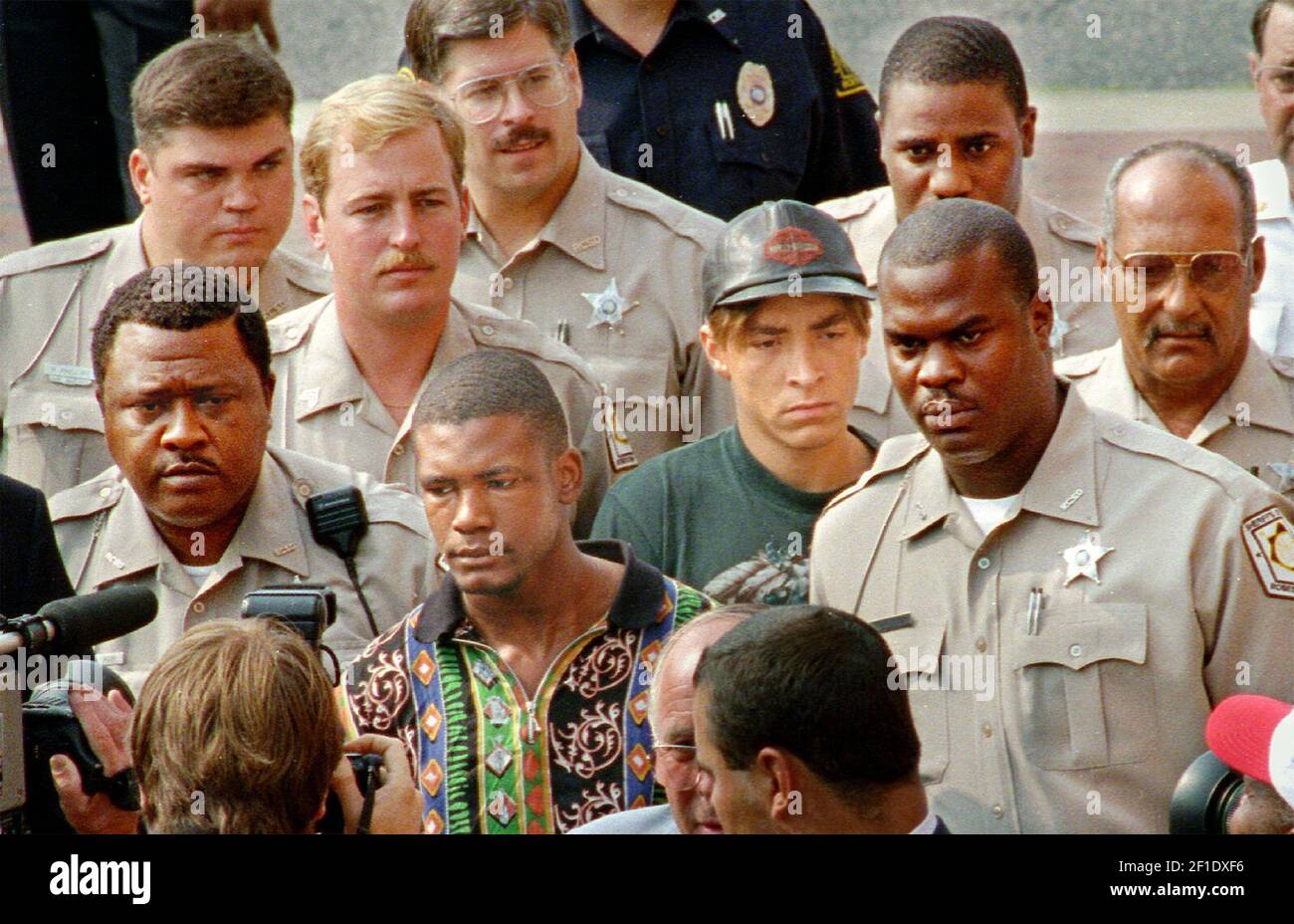 Daniel Green, left, and Larry Demery are surrounded by Robeson County ...