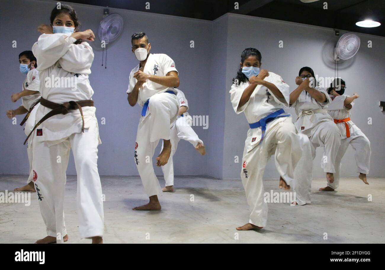 Karate students are seen in action during the training session in Dhaka. To help women fight ...