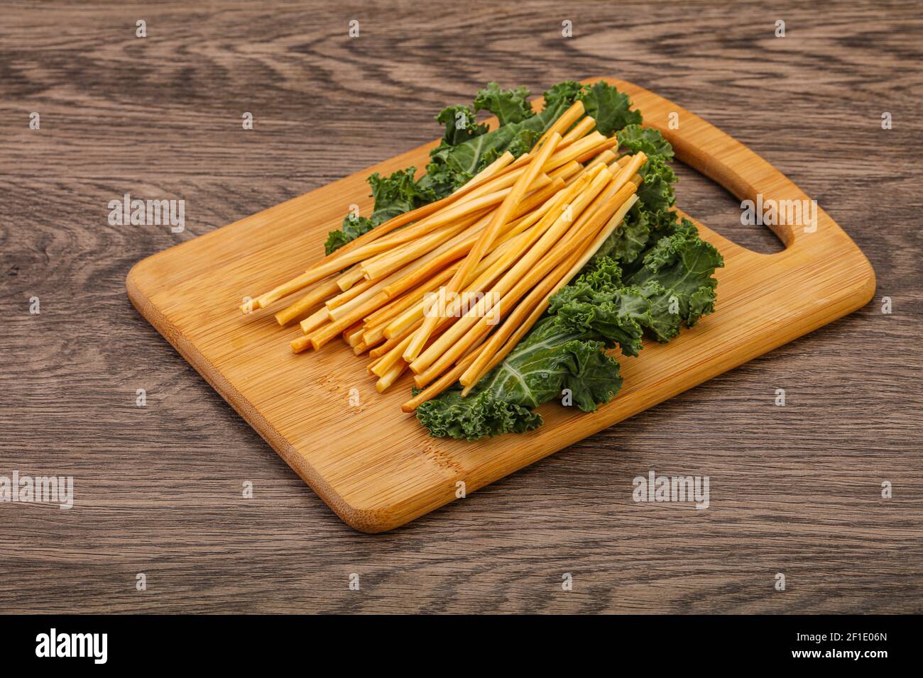 Caucasian Chechel cheese sticks over board Stock Photo - Alamy