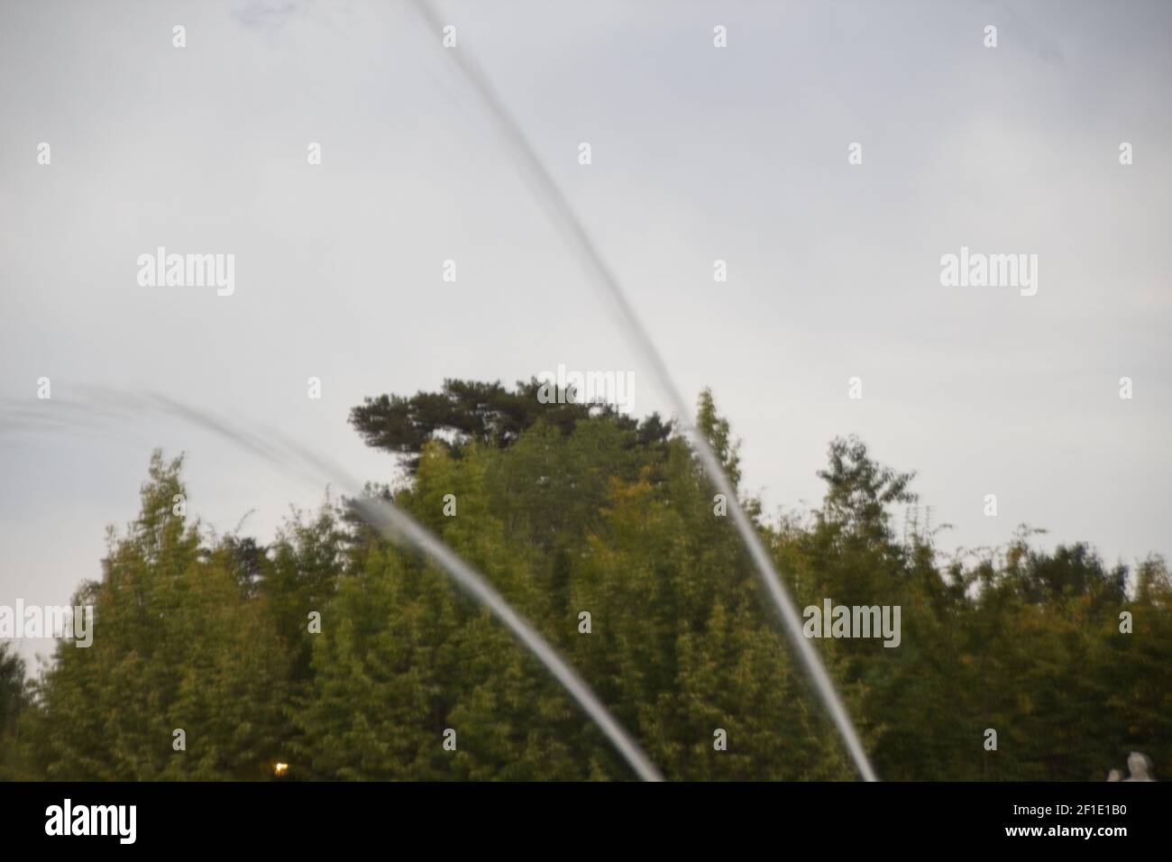 Water road sprinkler hi-res stock photography and images - Alamy