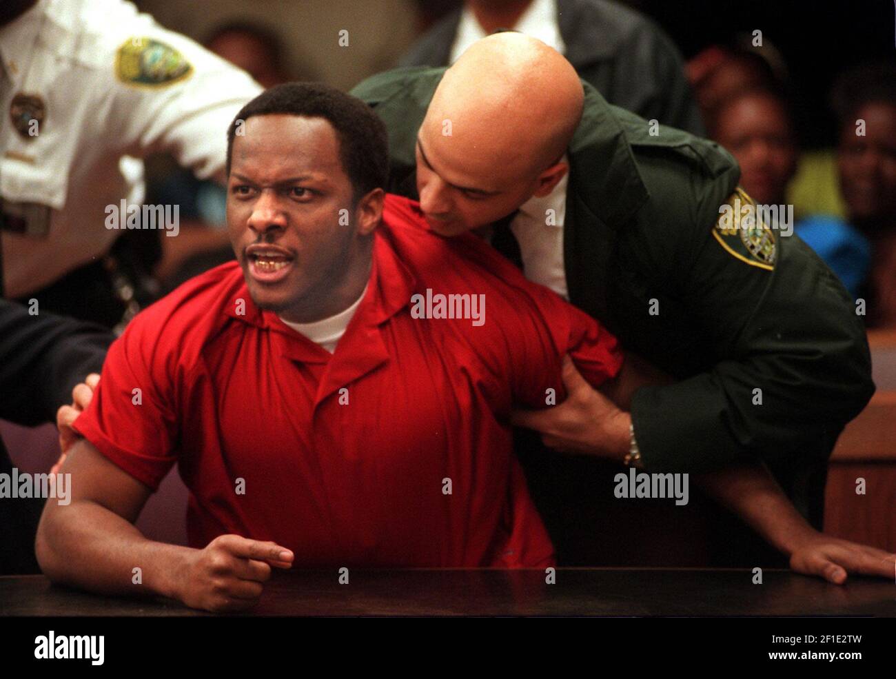 Labrant Dennis lost his temper and had to be restrained as he listened ...