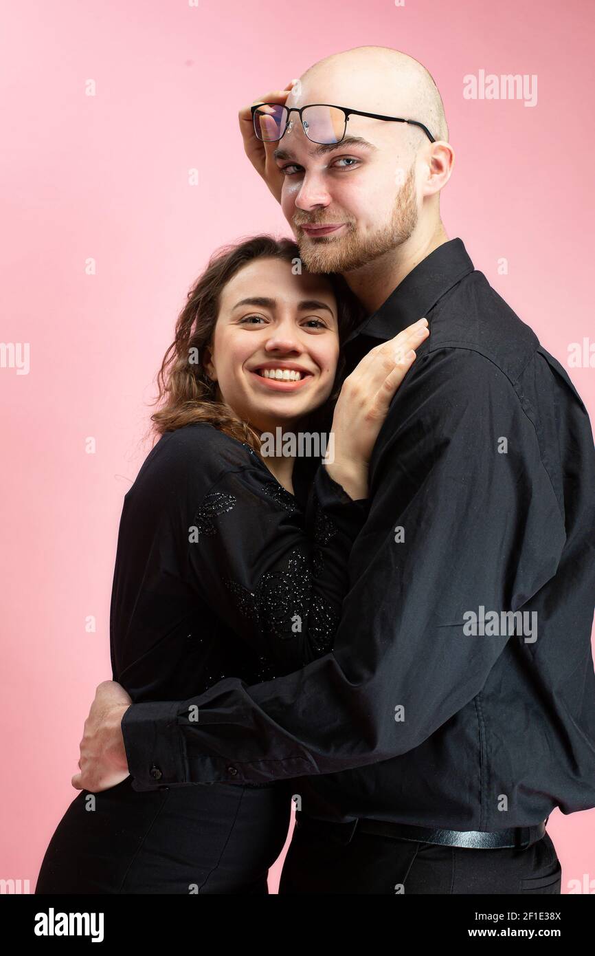 Two young white european people portrait isolated on pink Stock Photo ...