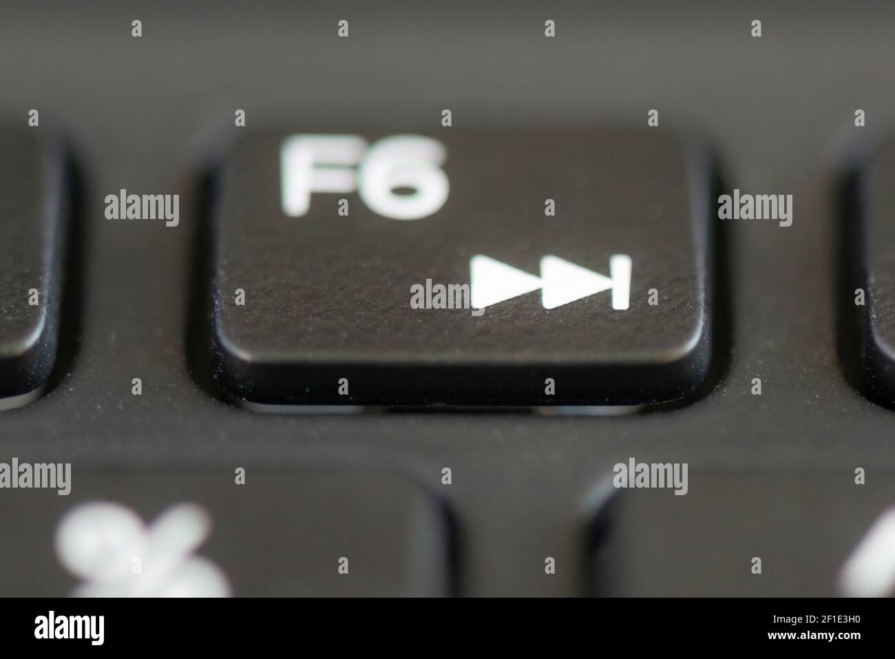 F6 and play next track key on a laptop keyboard Stock Photo - Alamy