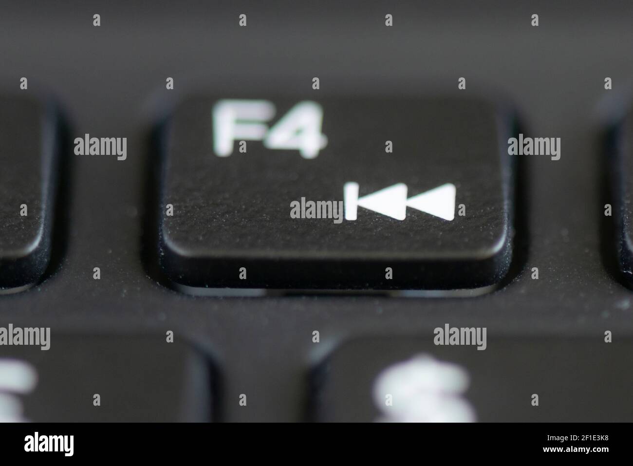 F4 and play previous track key on a laptop keyboard Stock Photo - Alamy