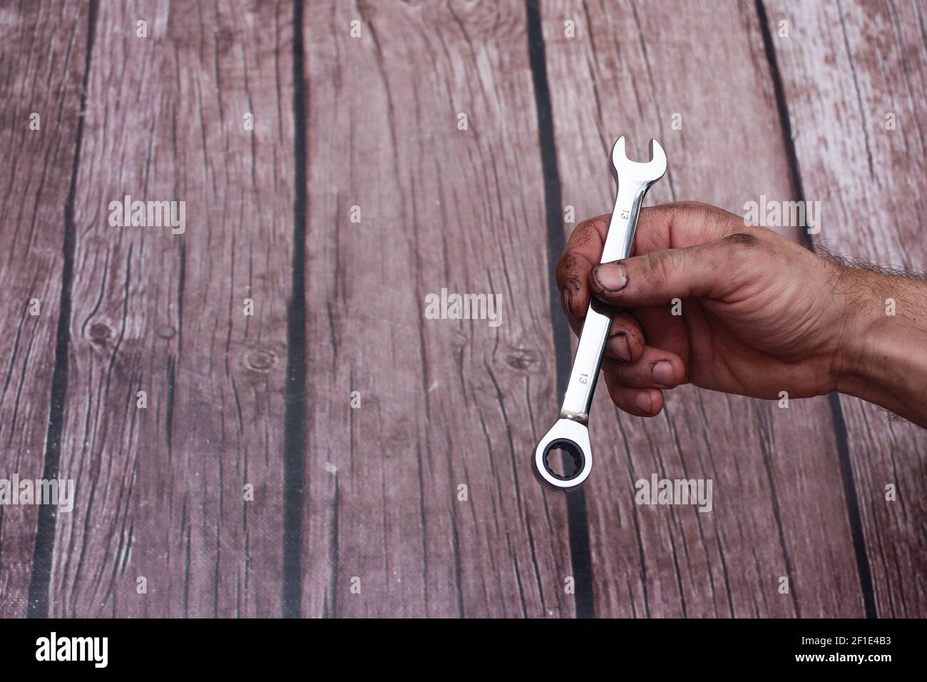 Person holding a wrench hi-res stock photography and images - Alamy