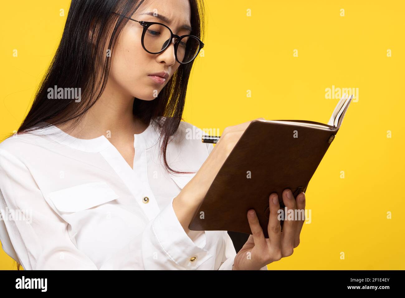 elegant woman holding notepad executive manager white shirt studio ...