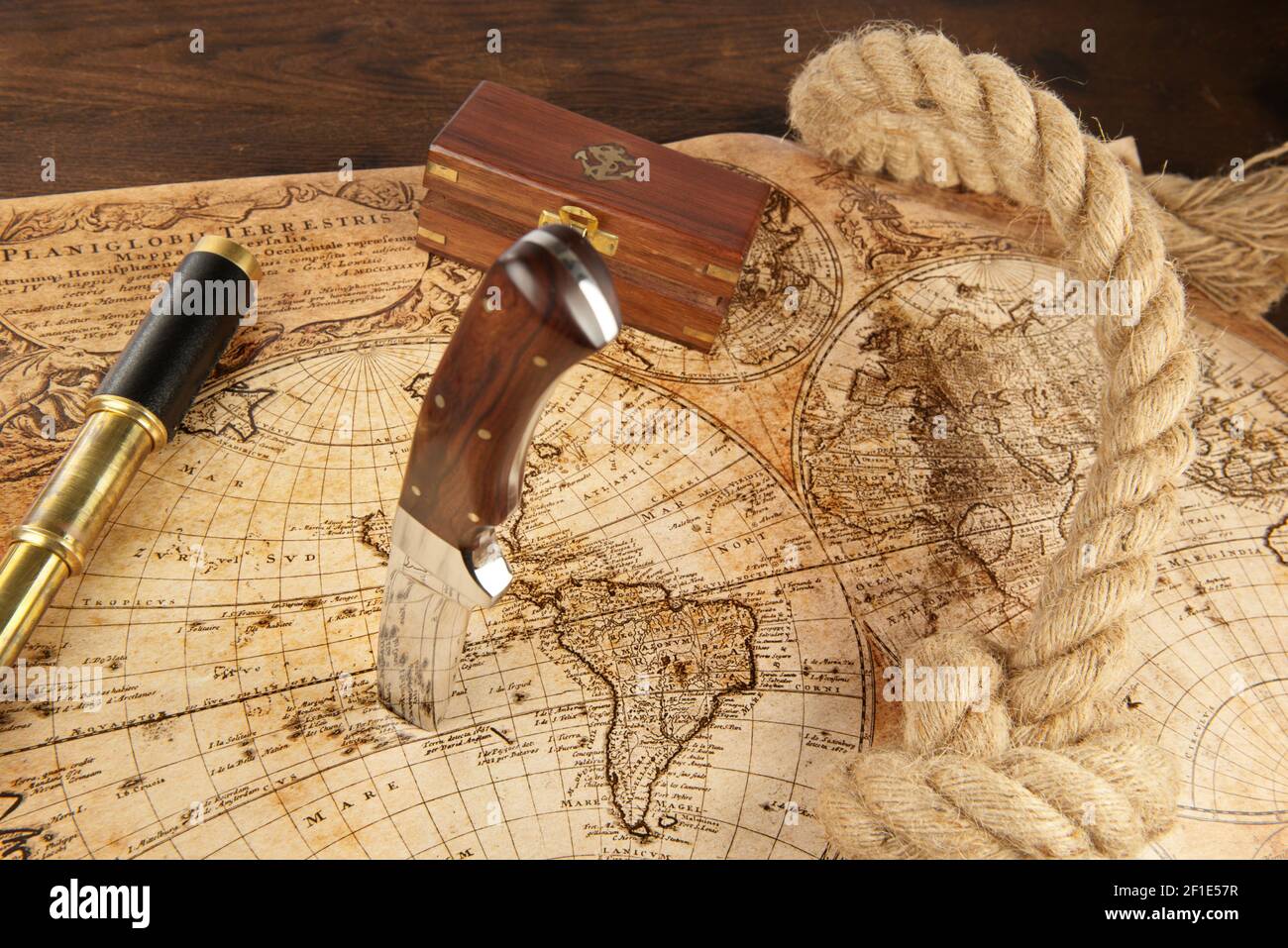 Knife sticking in a old Map to locate the Treasure Stock Photo - Alamy