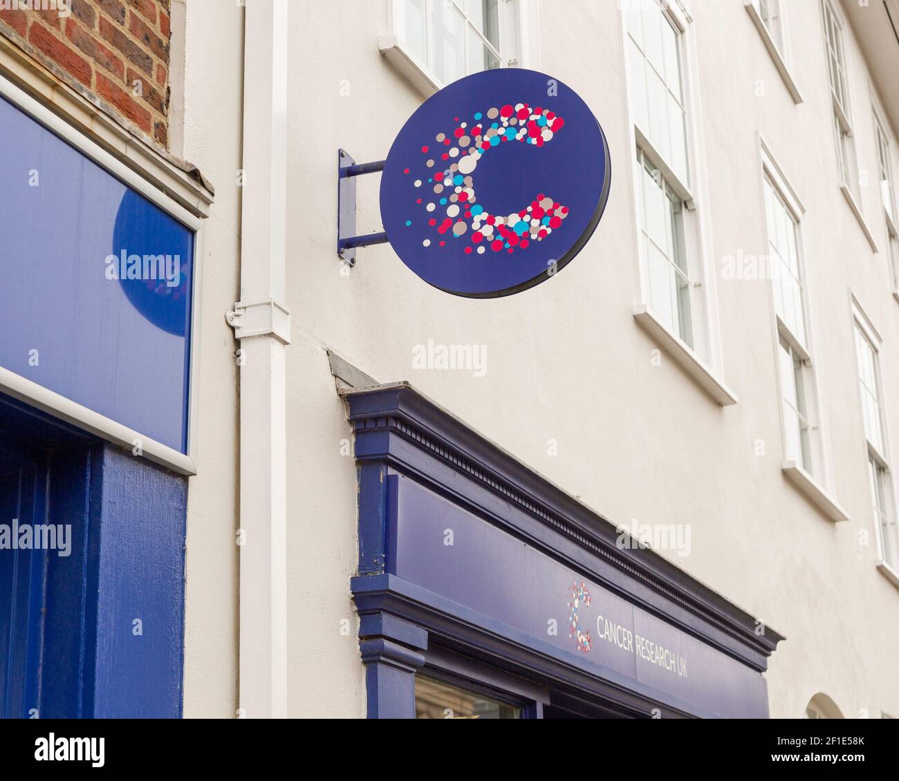 Cancer Research charity shop signs outside High Street store, UK Stock ...
