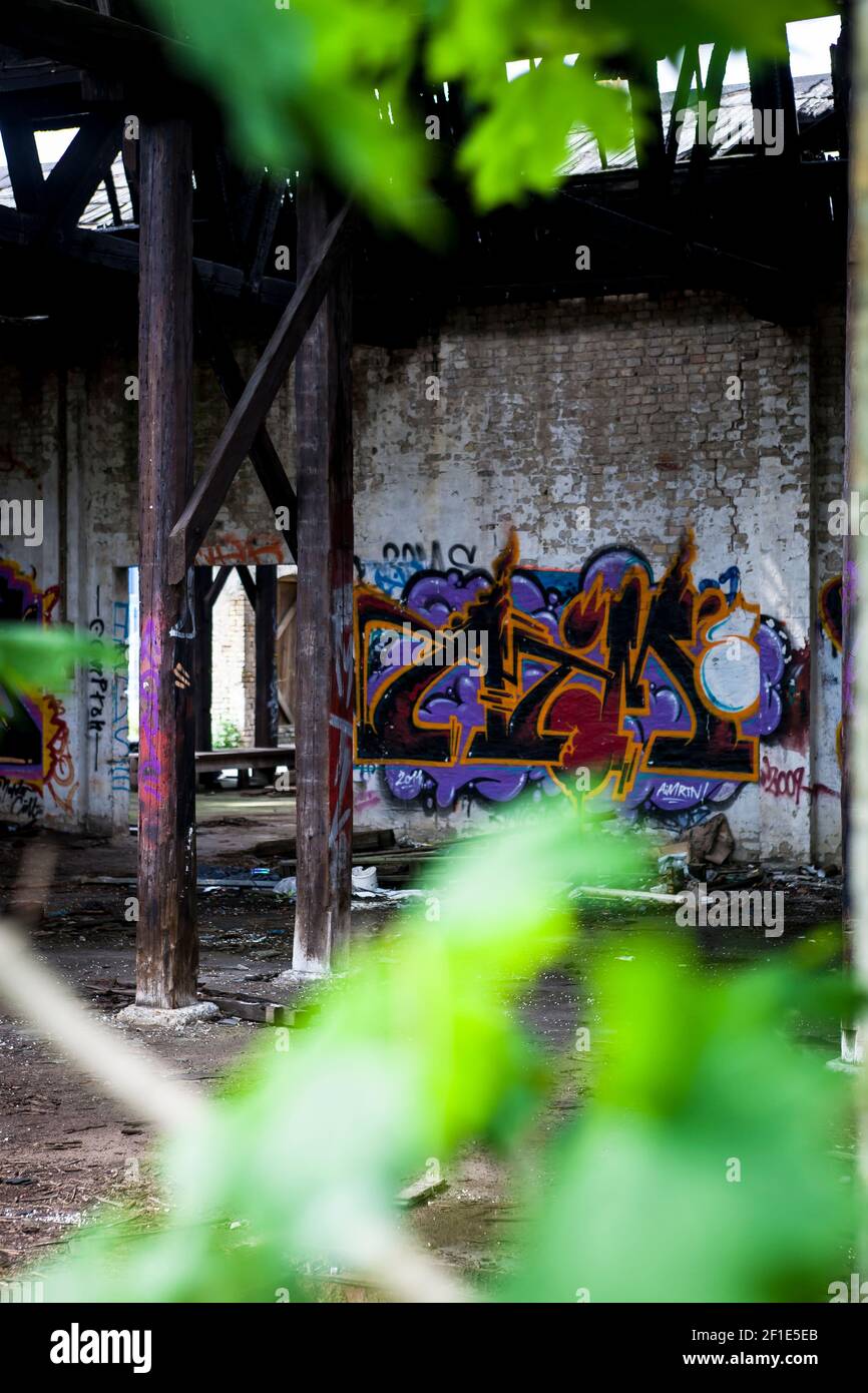 Graffiti on a old grey abandoned building Stock Photo - Alamy