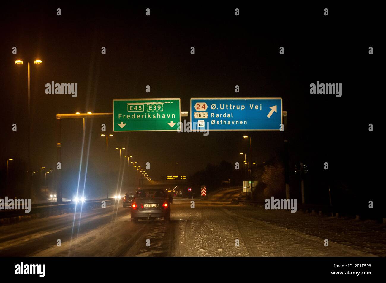 A cold snowy road at night Stock Photo - Alamy