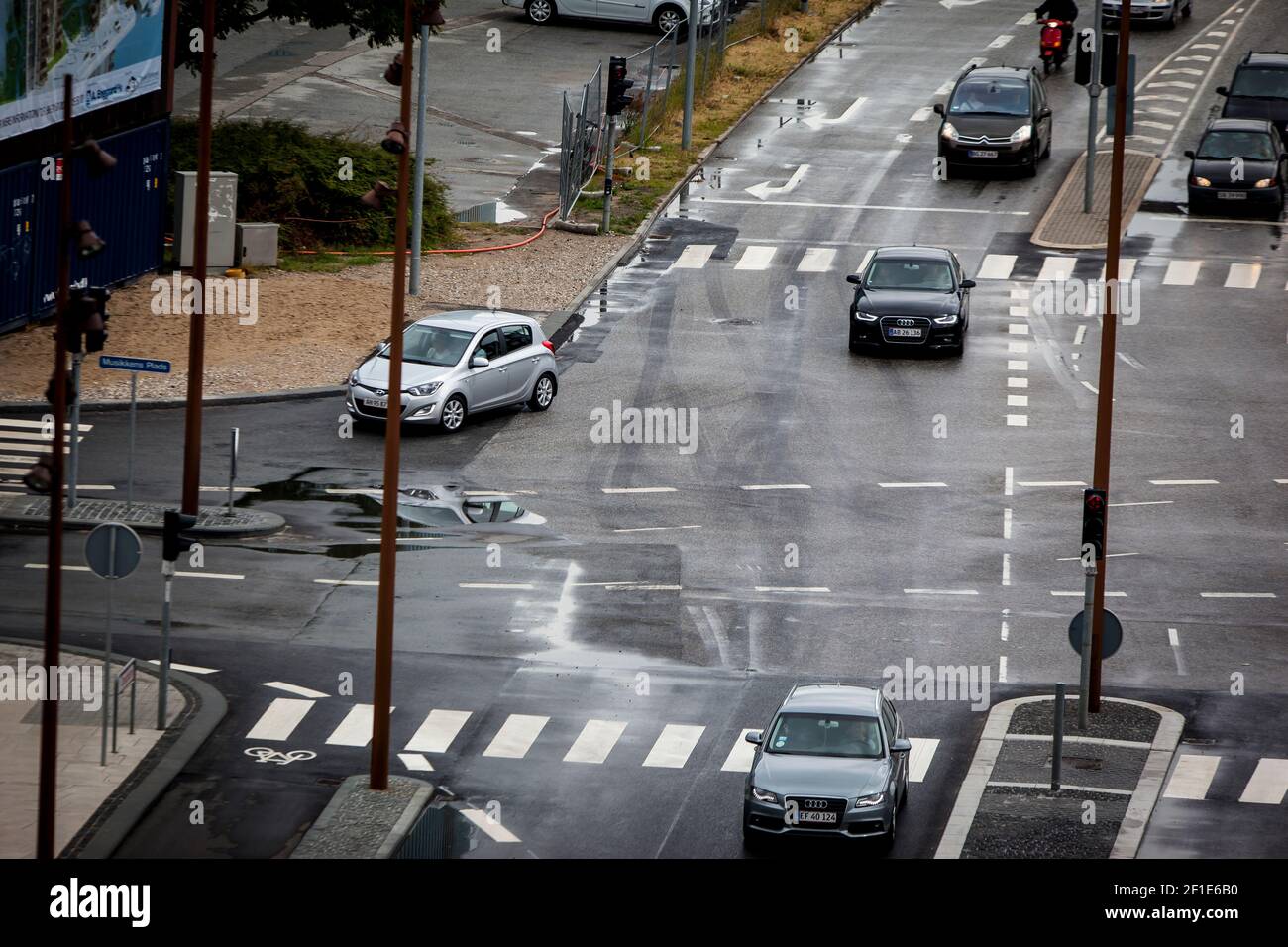 Traffic at a crossing road in a danish city Stock Photo - Alamy