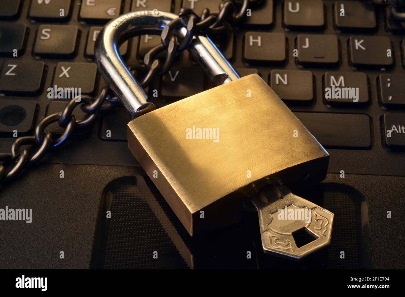 Detail of a metallic security padlock above a computer keyboard Stock ...