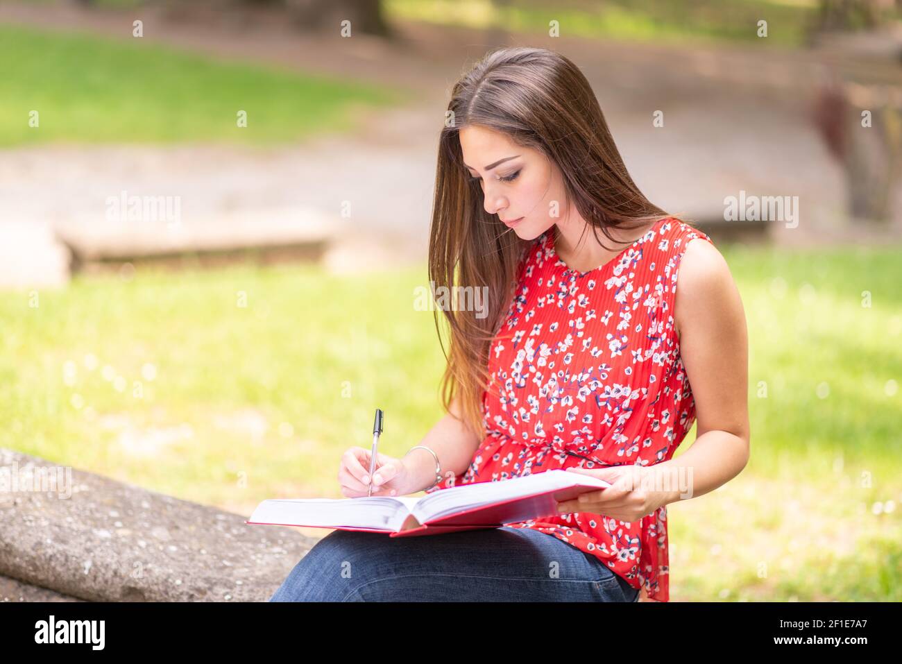 Young college student taking book hi-res stock photography and images ...