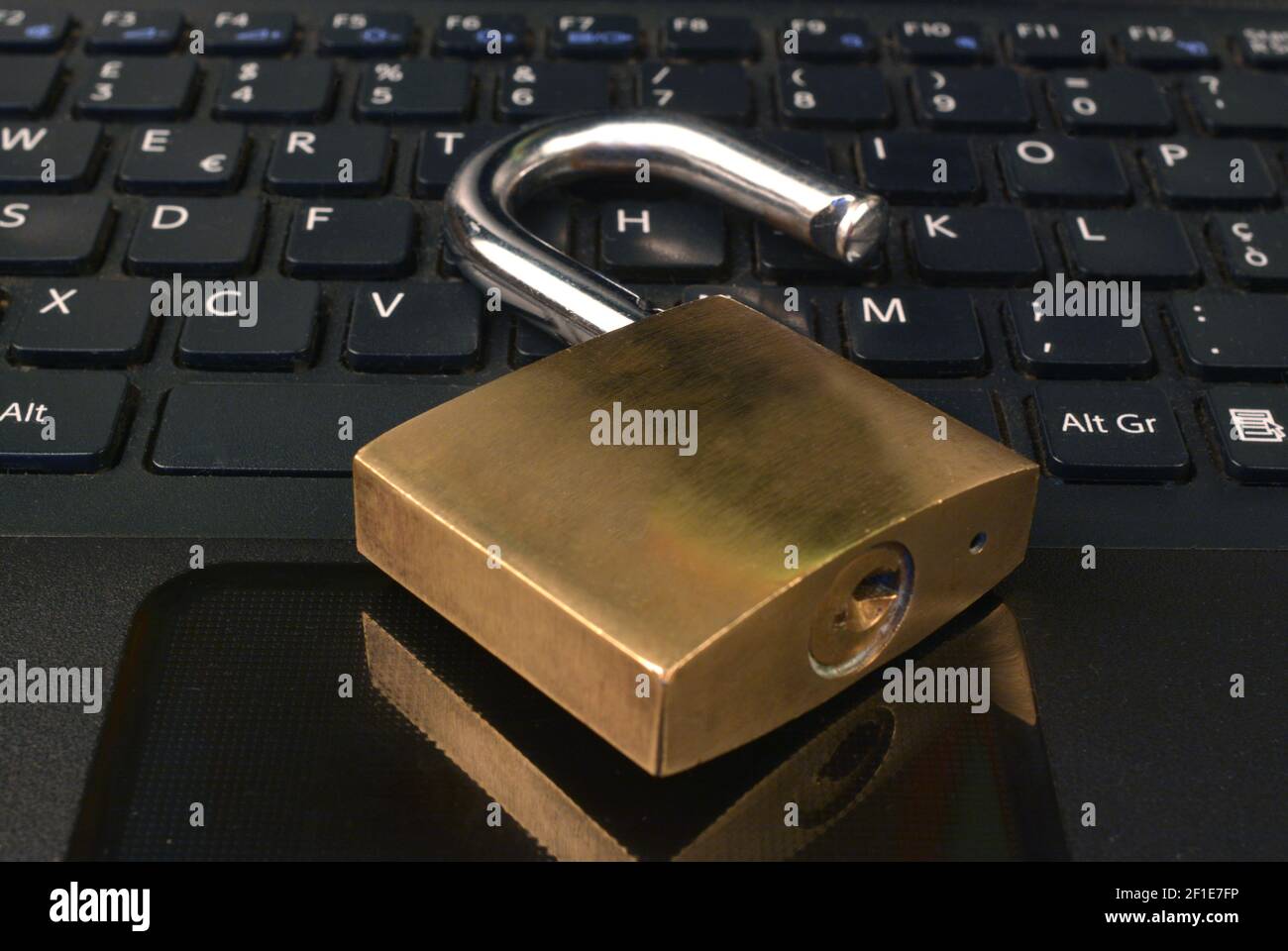 Detail of a metallic security padlock above a computer keyboard Stock ...