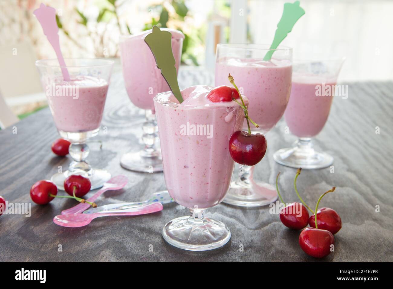 Colourful milkshake with cherry Stock Photo - Alamy