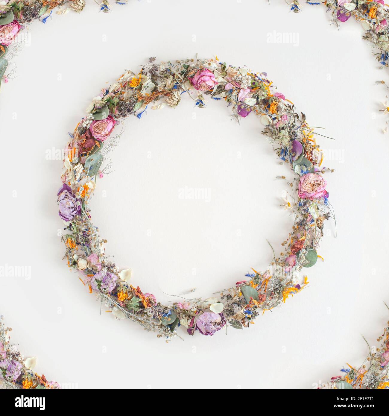 Creative round frame made with colorful summer dried natural flowers ...