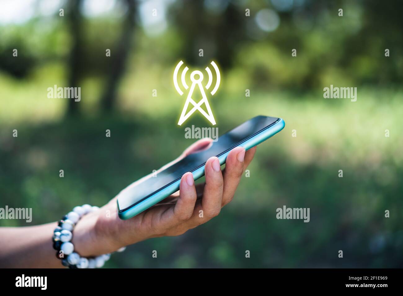 People hand using smartphone looking for signal wifi in off the grid no ...