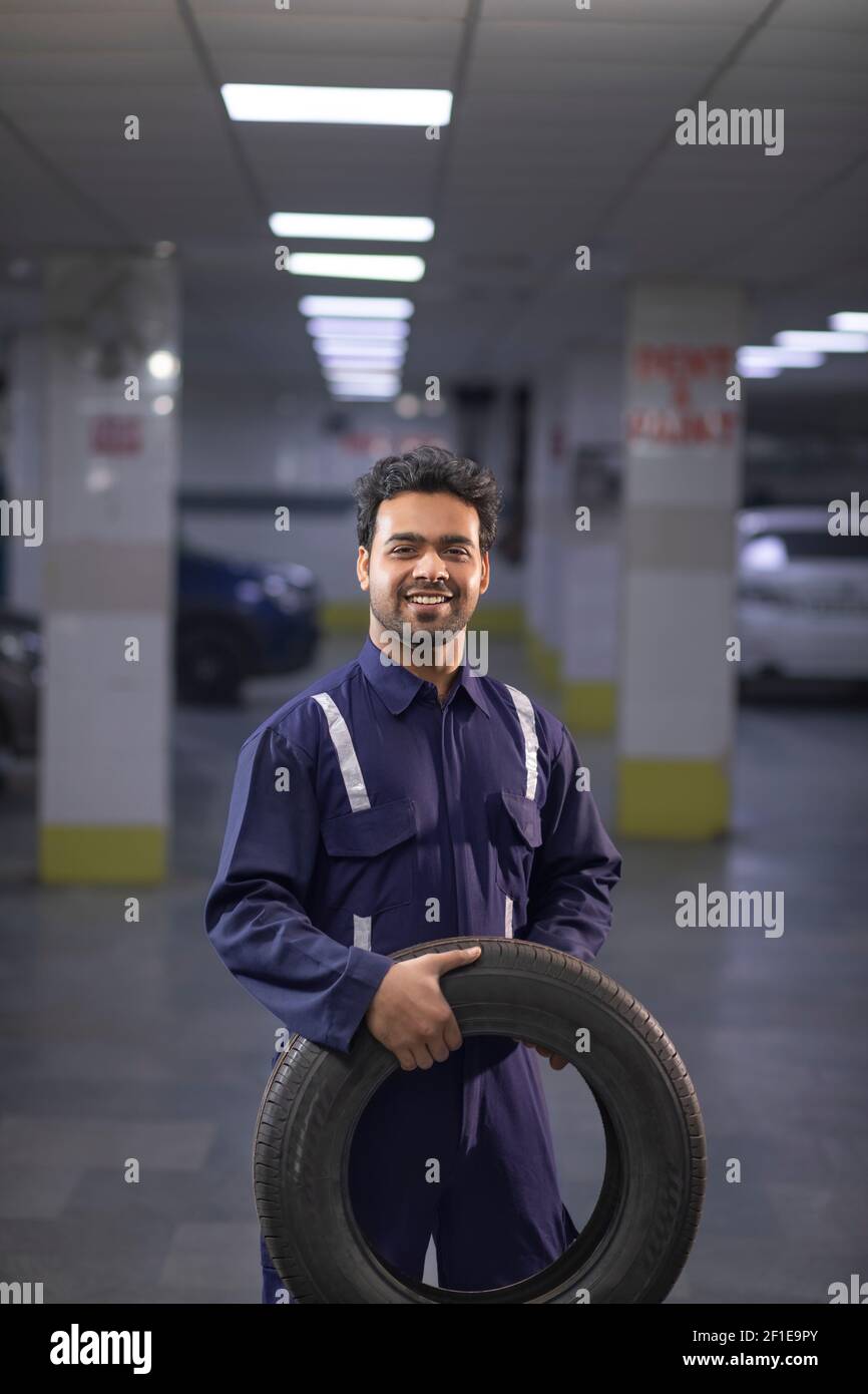 Smiling repairman holding in hi-res stock photography and images - Alamy