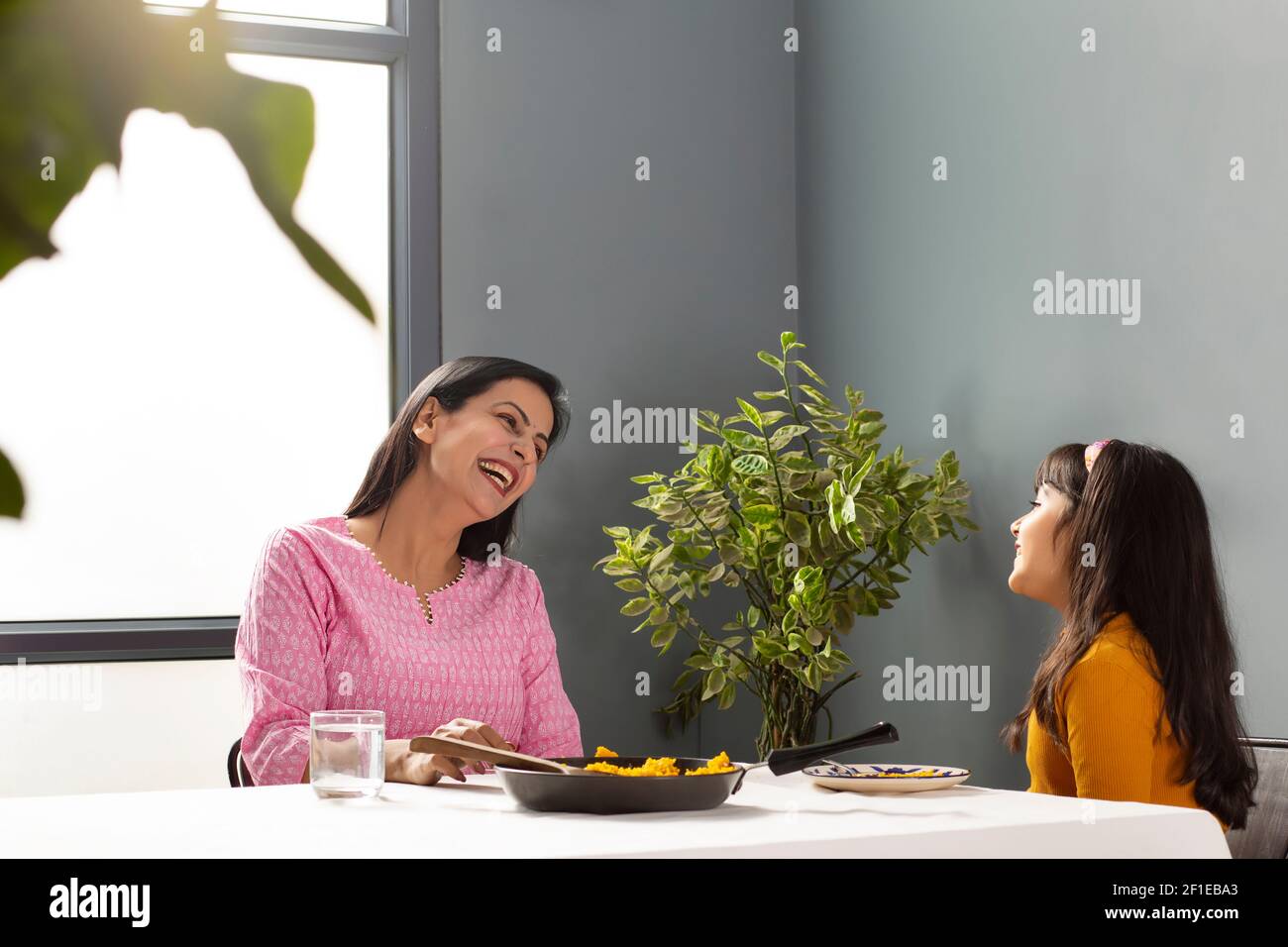 Indian girl eating rice hi-res stock photography and images - Alamy