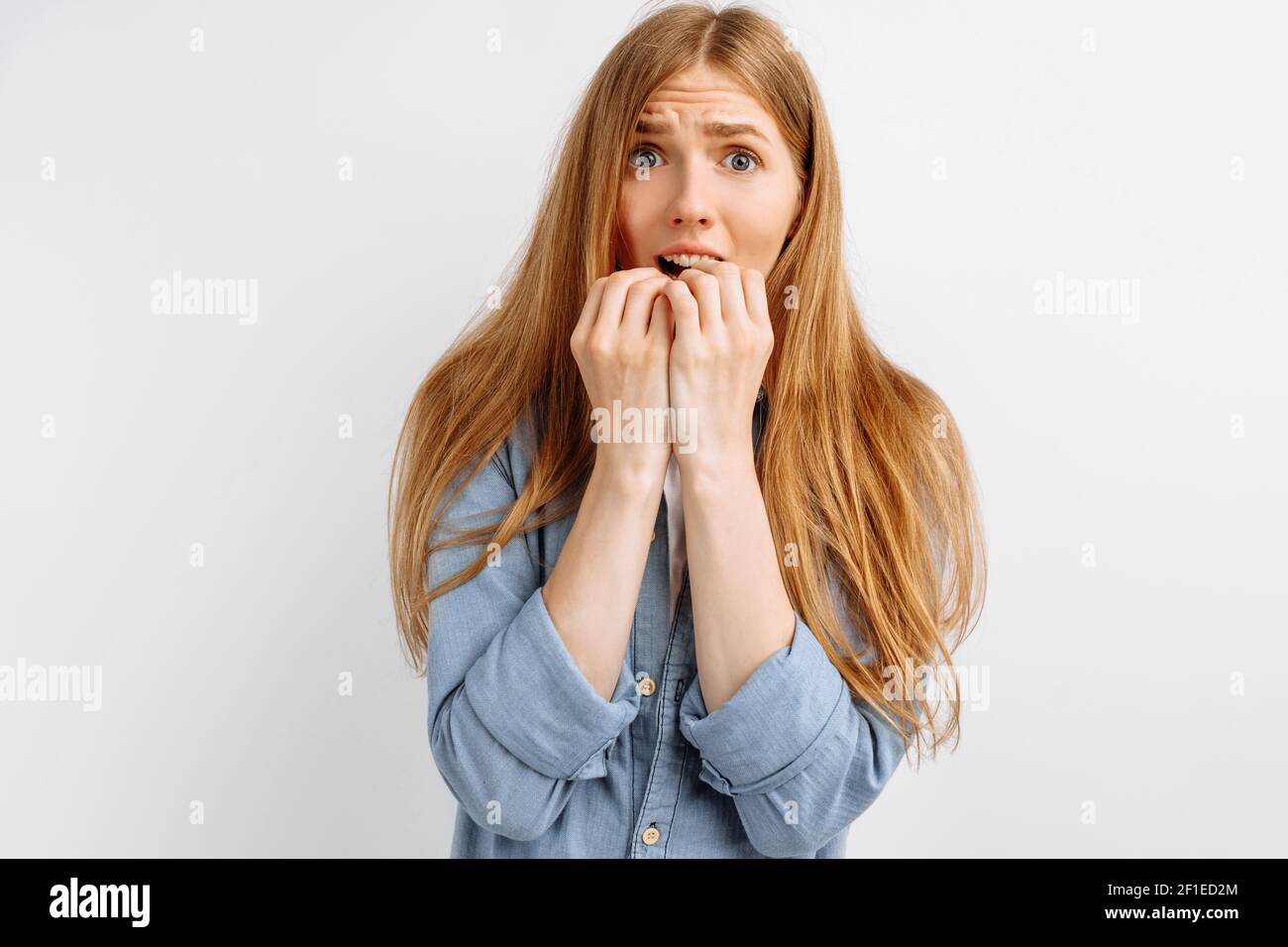 I'm afraid. Portrait of a frightened woman, on an isolated white ...