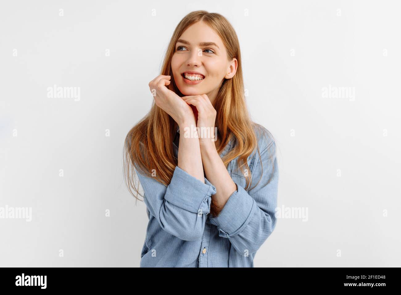Young beautiful woman with hand on chin, thinking about question, with ...