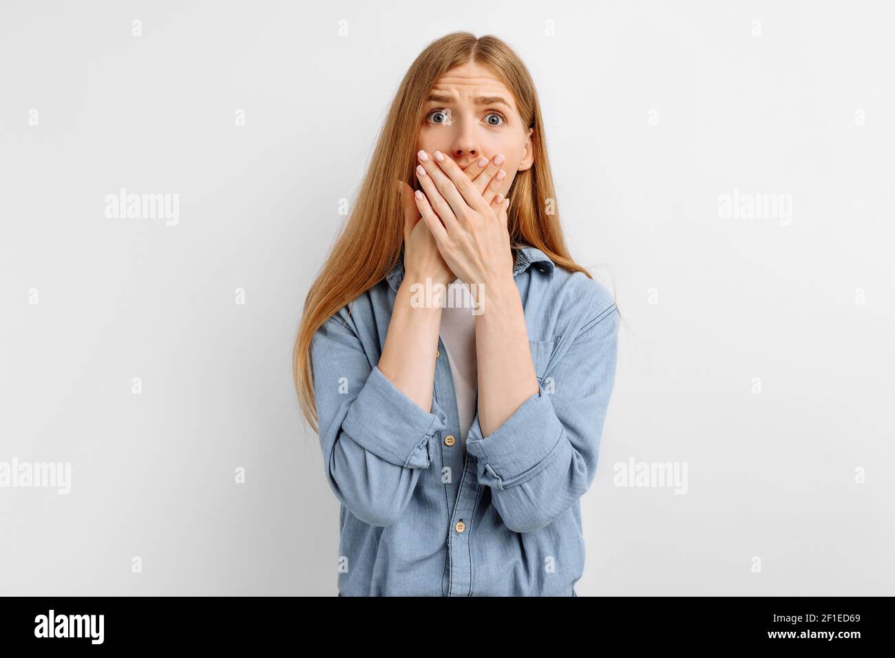 I'm afraid. Portrait of a frightened woman, on an isolated white ...