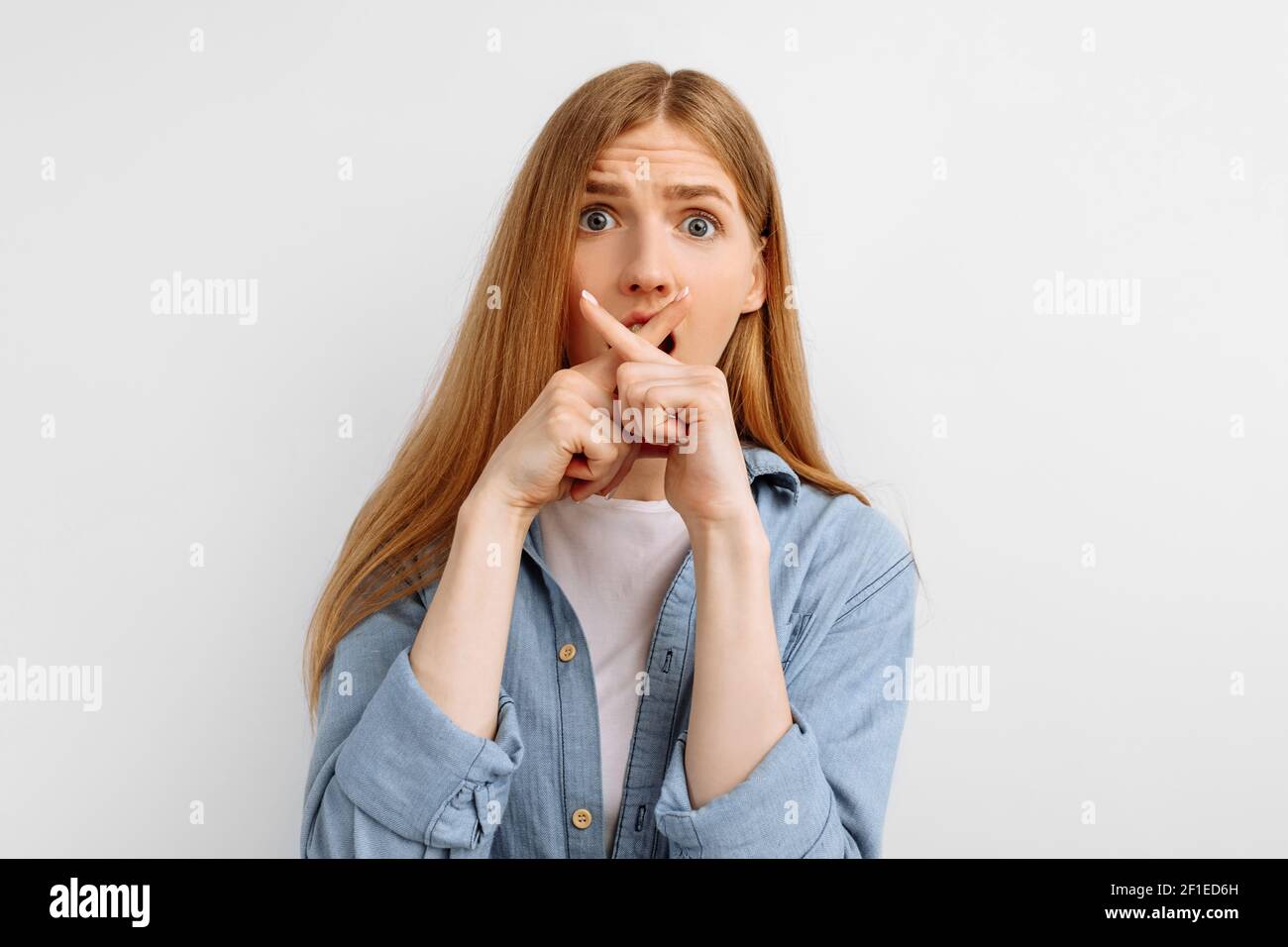 I'm afraid. Portrait of a frightened woman, on an isolated white ...