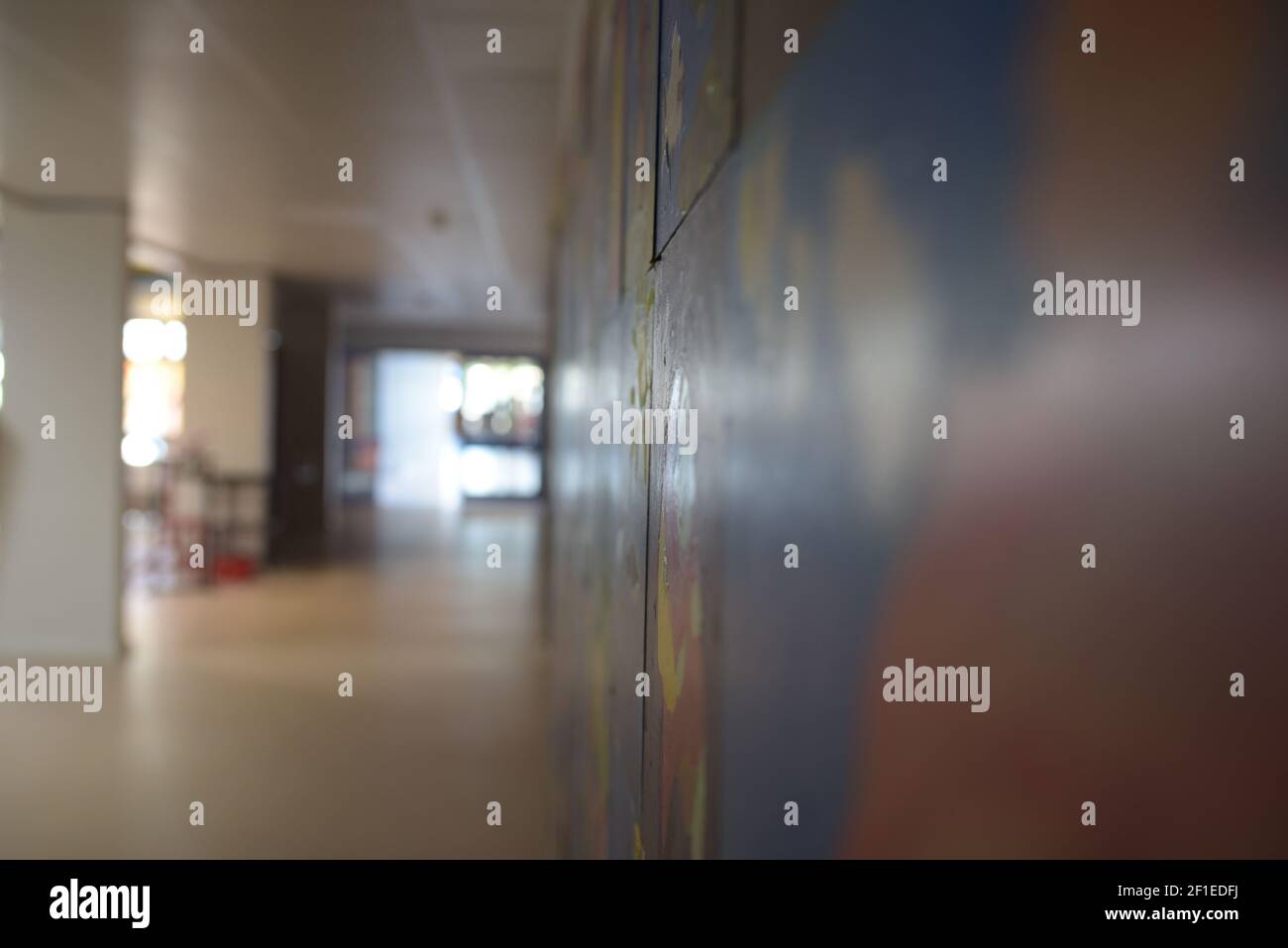 Closeup of colorful wall at a school hallway Stock Photo - Alamy