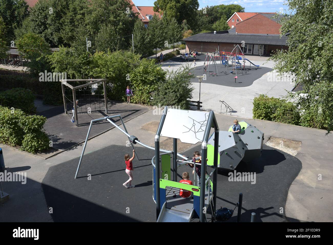Overview of kids playing on the playground at a school Stock Photo - Alamy