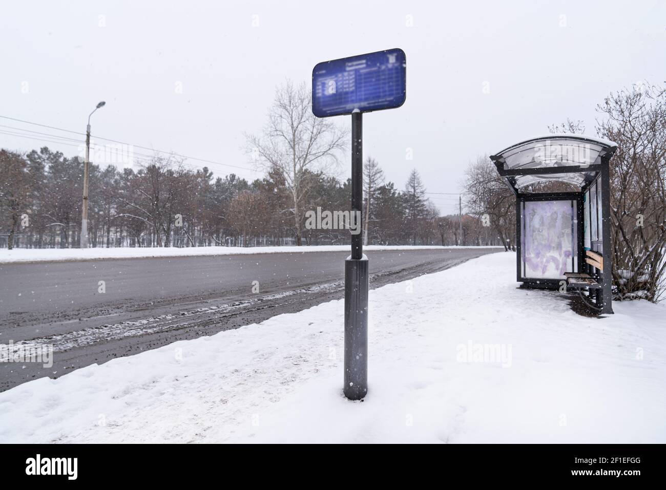 bus and transport stops in the suburbs near the forest. A sign with a ...