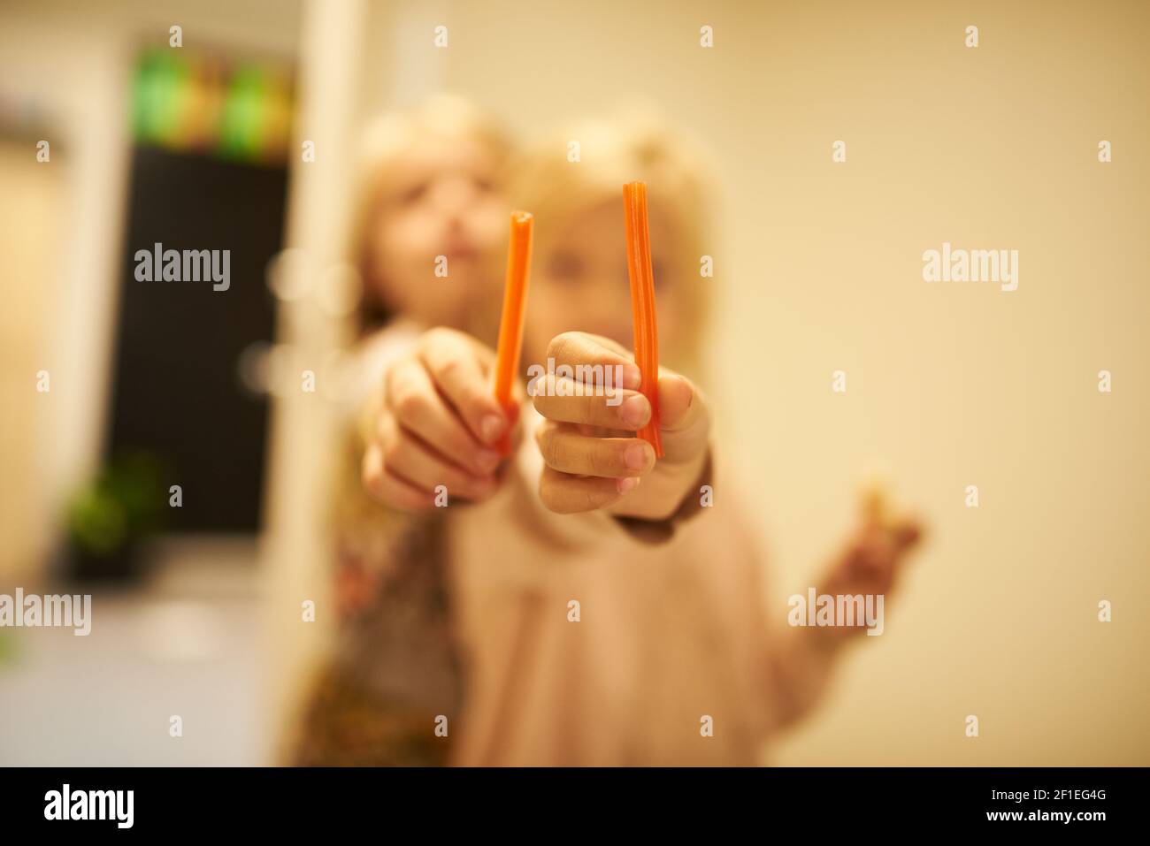 Two kids eating lickerish at school Stock Photo - Alamy