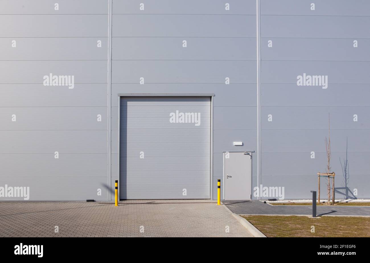 Gray iron shutter of an industrial building -warehouse gate Stock Photo ...