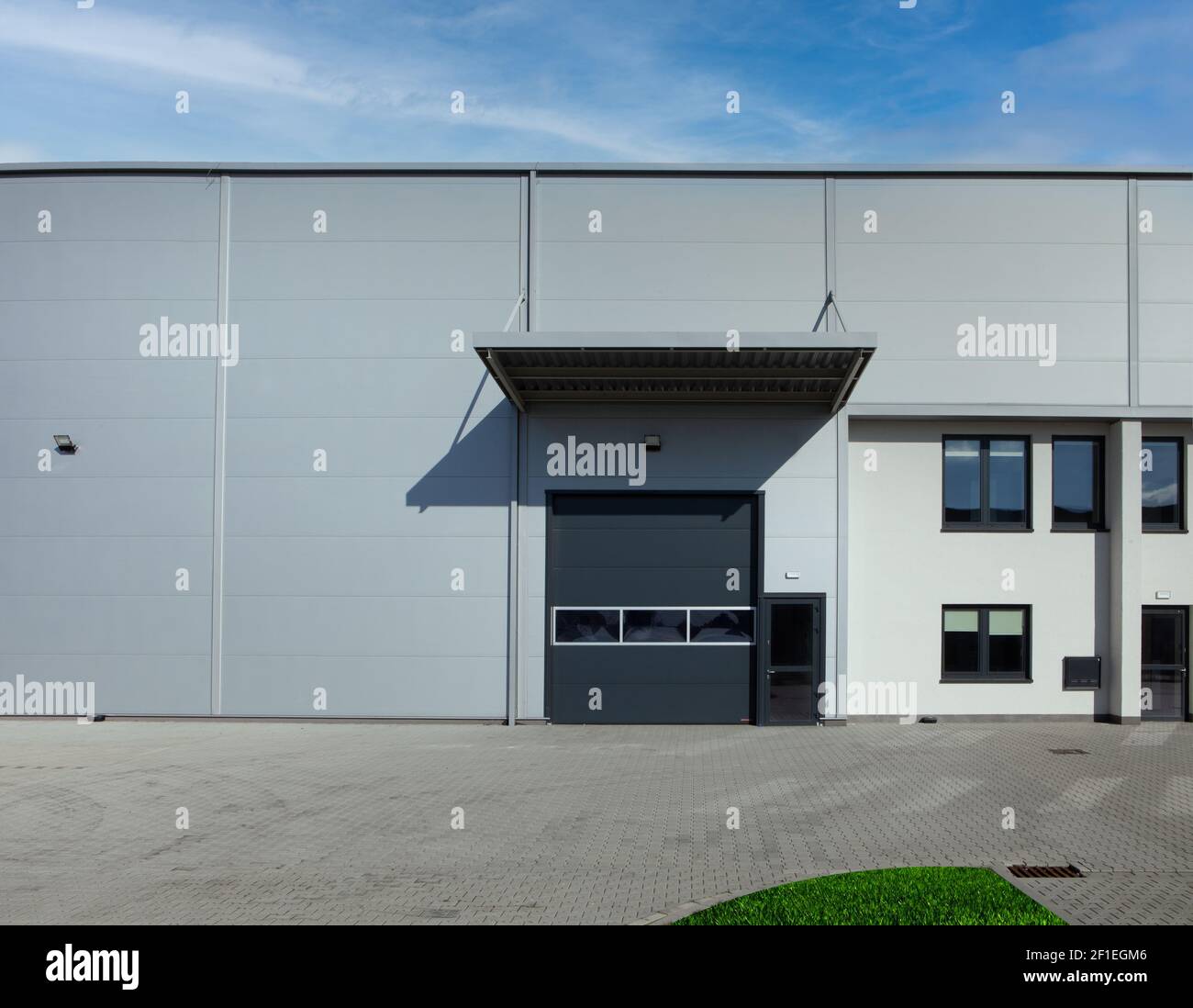 Gray iron shutter of an industrial building with gray Stock Photo - Alamy