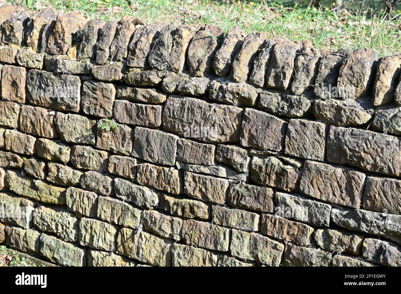 A dry stone wall bathed in spring sunshine in the north Oxfordshire ...