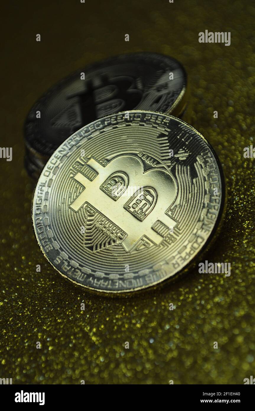 Macro view of gold and silver color shiny coins with Bitcoin symbol ...