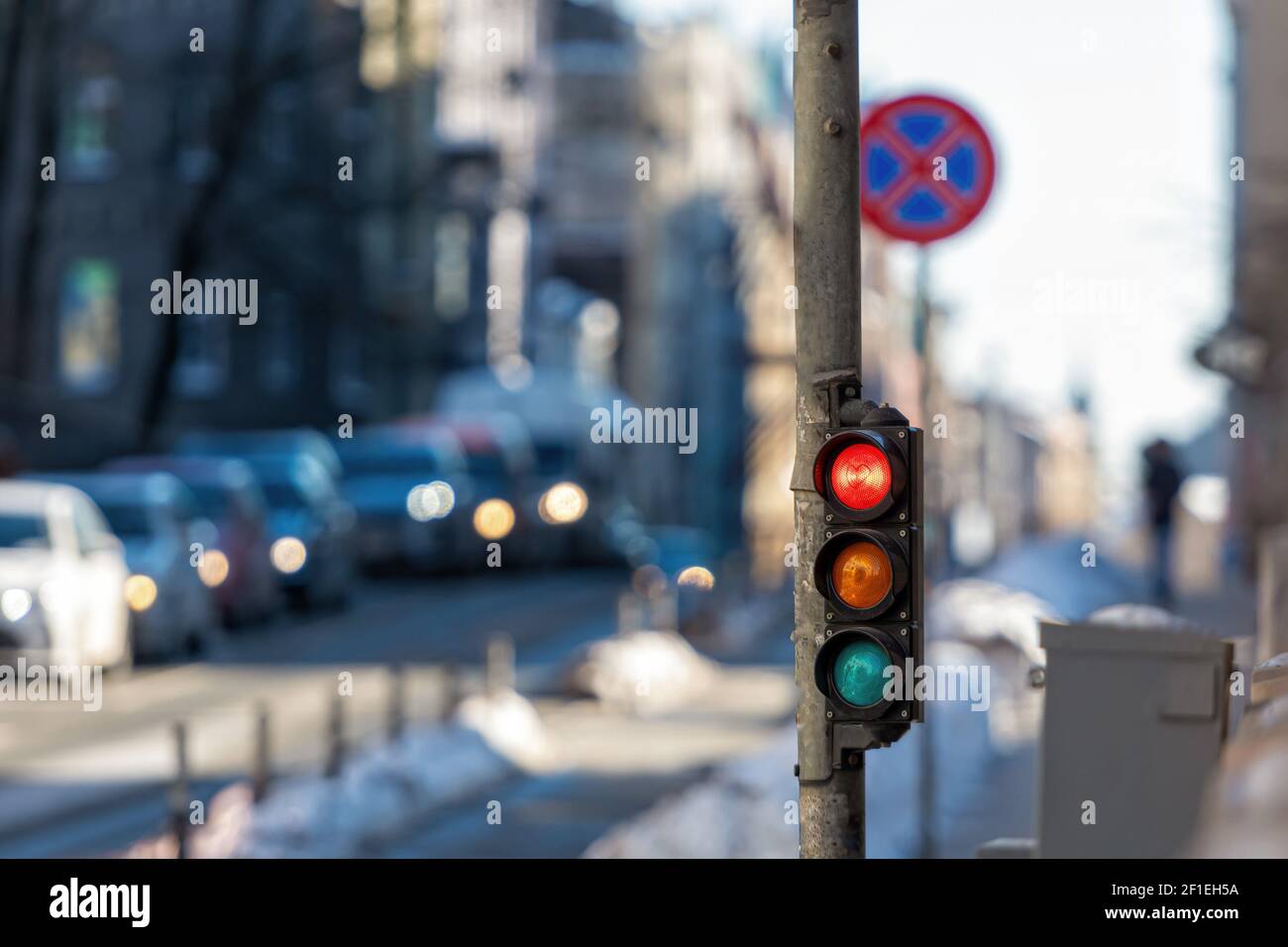 close-up of small traffic semaphore with red light against the backdrop ...