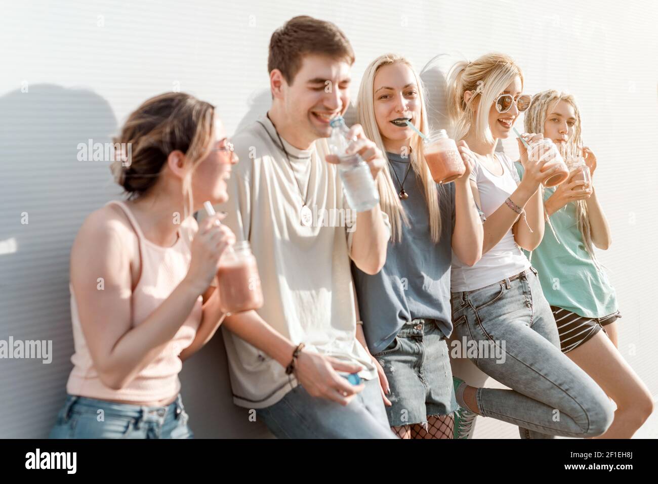 Group of young real people friends hanging together and having fun ...