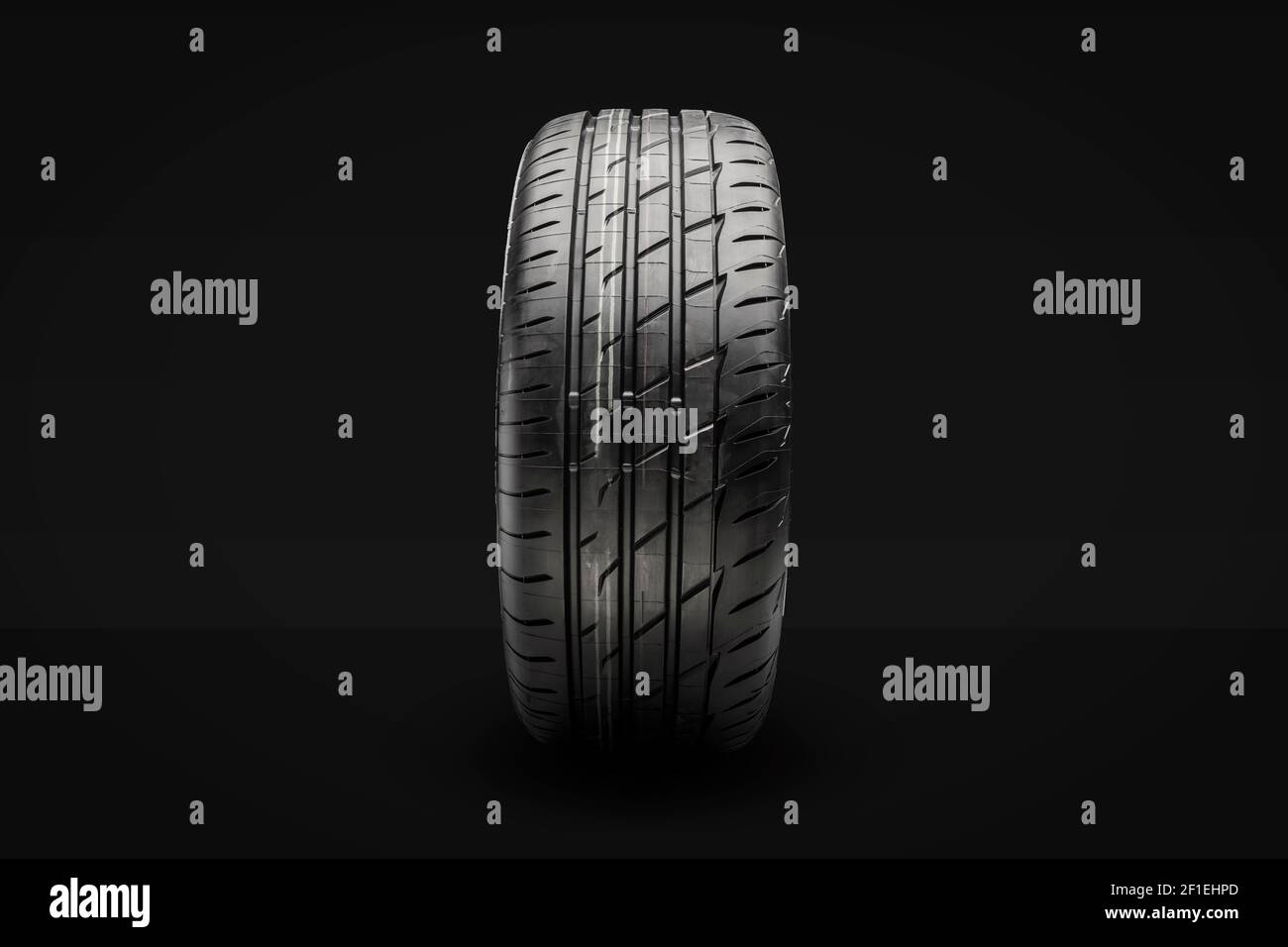 new summer tire. front view, black background Stock Photo - Alamy