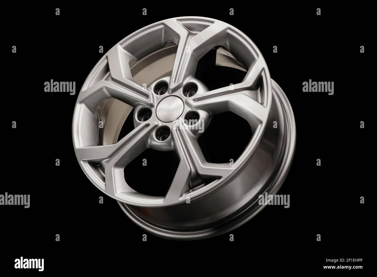 New modern alloy wheel close-up on a black background. Car beautiful ...