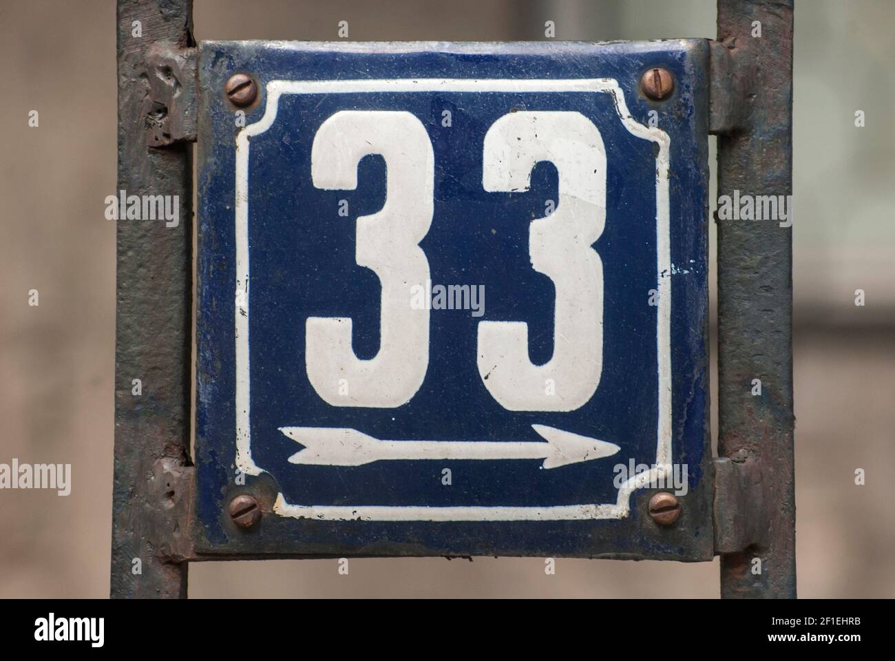 Weathered grunge square metal enamelled plate of number of street ...